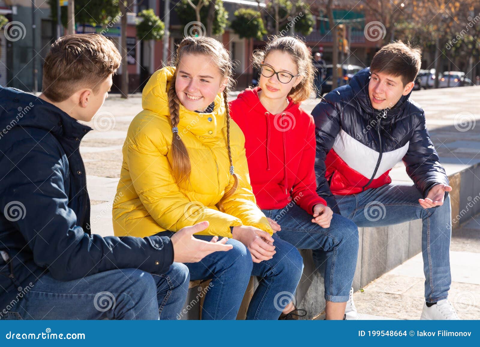 Teenagers are Talking about Play on Walk in the Park Stock Photo ...