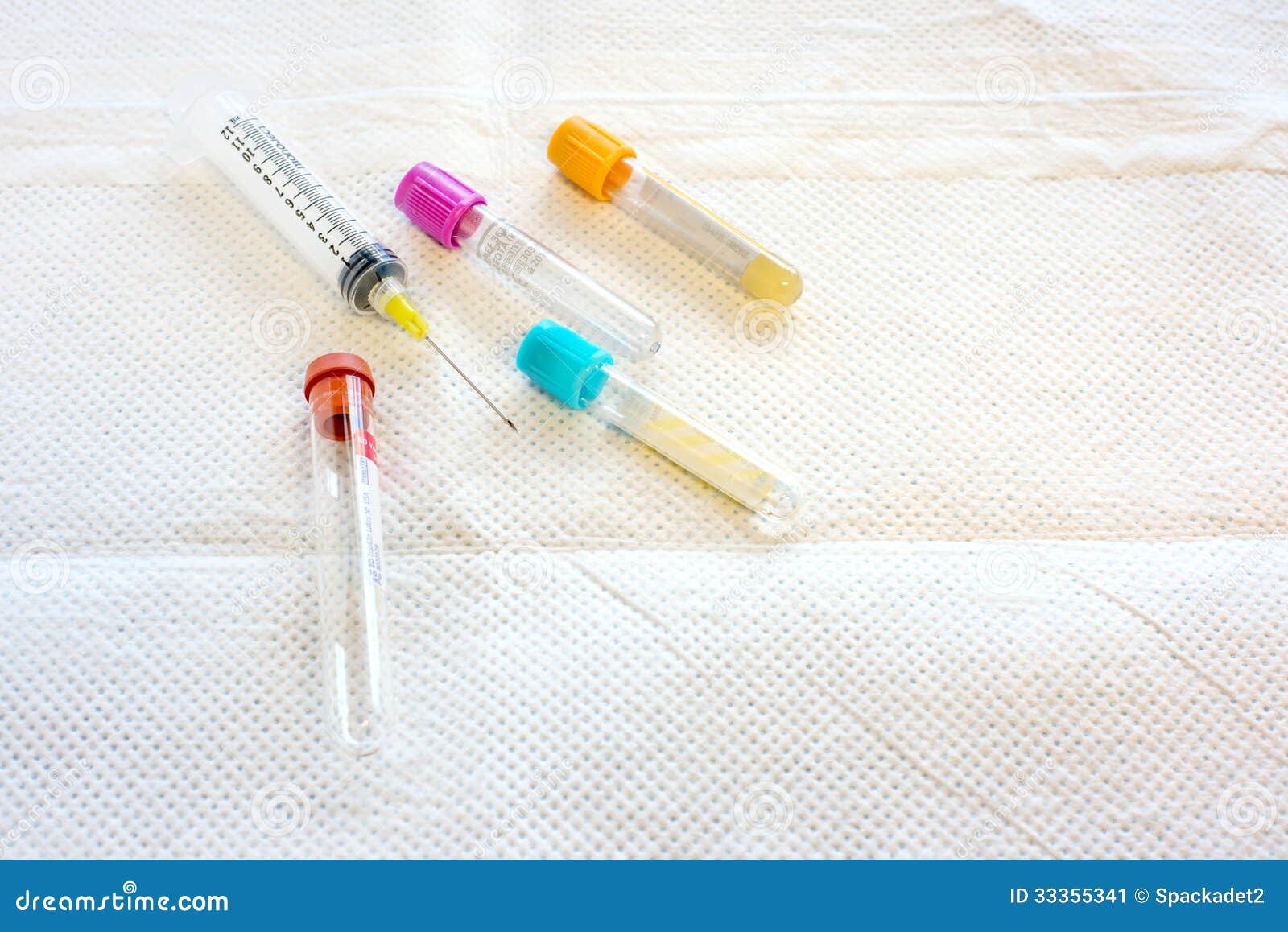 Four Test Tubes and a Syringe on a Disposable Pad Stock Image - Image ...