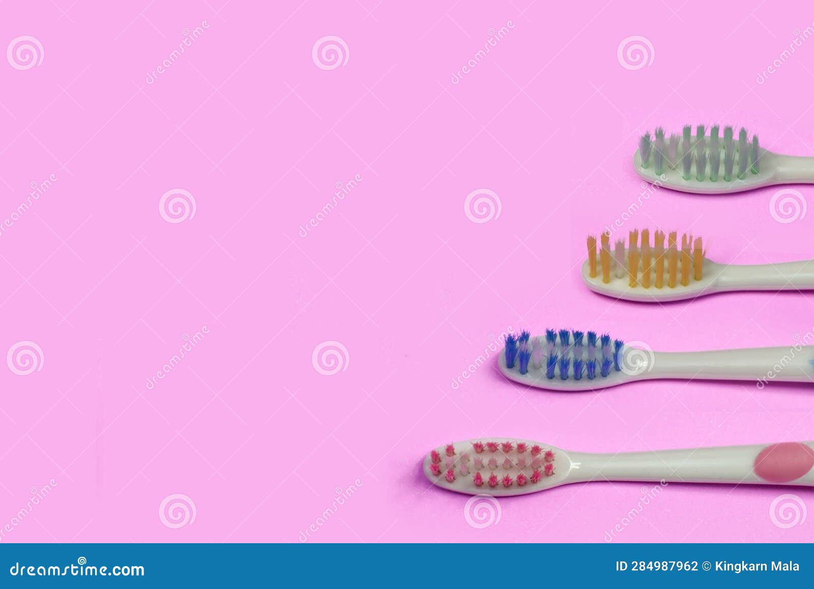 Four Toothbrushes, Assorted Colors, on a Pink Background Stock Photo ...