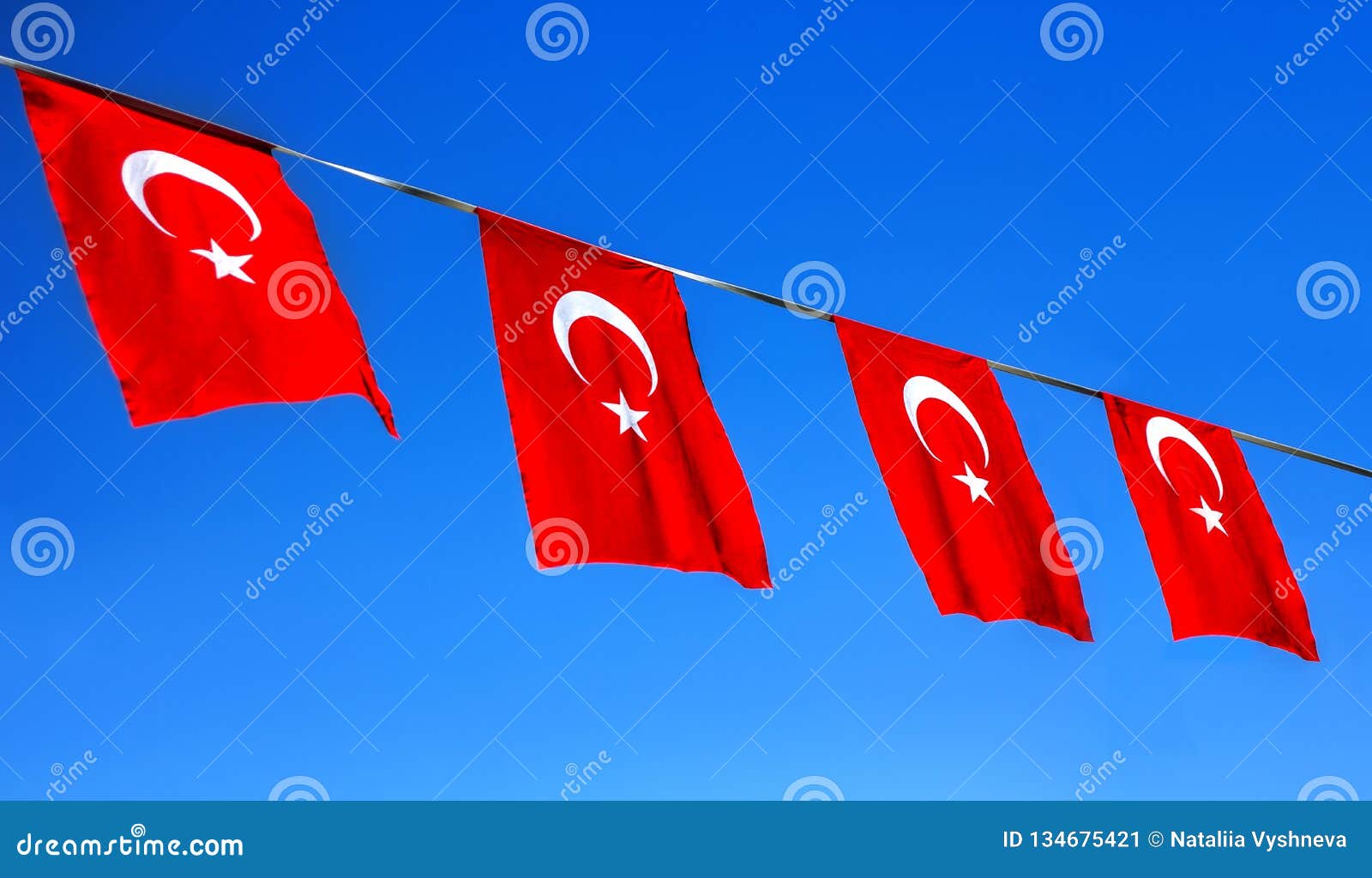 Four Turkish Flags Flying Against the Bright Blue Sky Stock Image ...