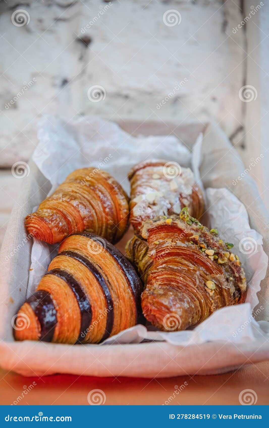 Four Types of Croissants in a Basket on a White Table Stock Image ...
