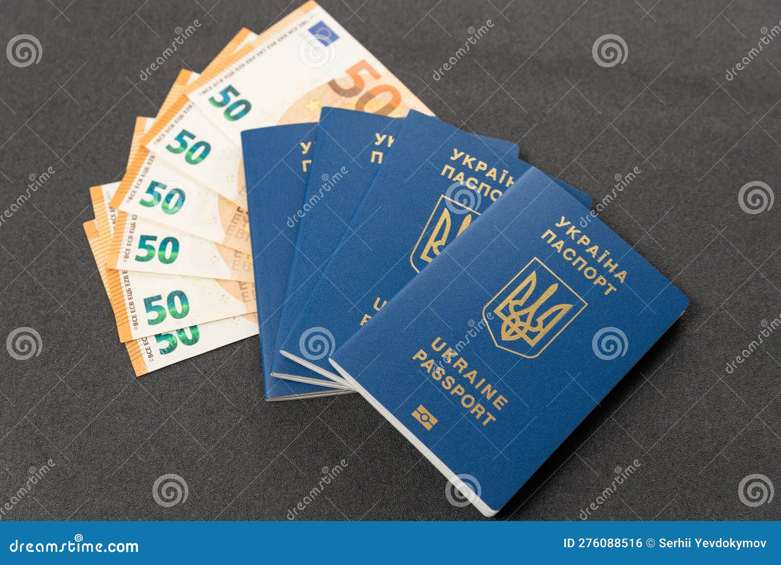 Four Ukrainian Biometric Passport And Money Euros Cash Concept