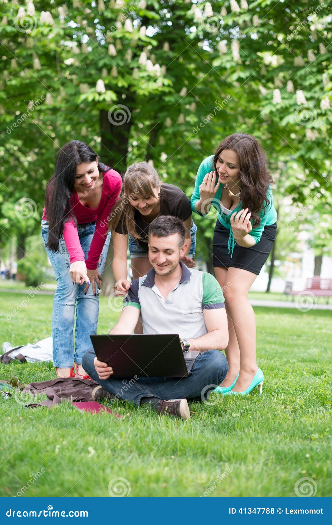 Four University Students Comparing Their Notes Stock Photo - Image of ...