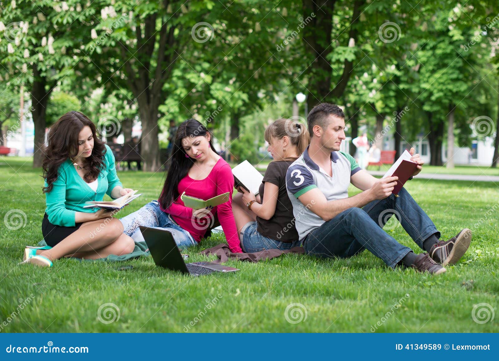 Four University Students Comparing Their Notes Stock Image - Image of ...