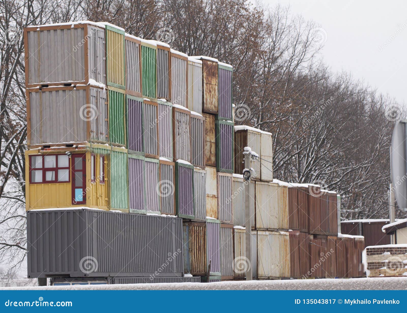 Four Vertical Rows of Shipping Containers that are Different Colors ...