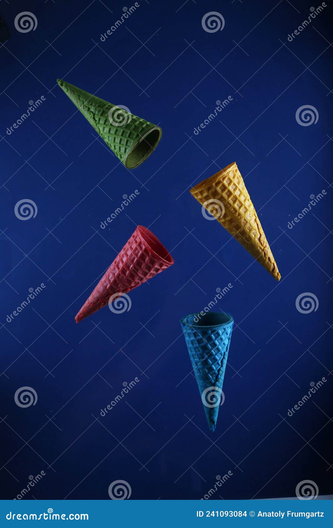 Four Waffle Cones of Different Colours Levitating Against Blue ...
