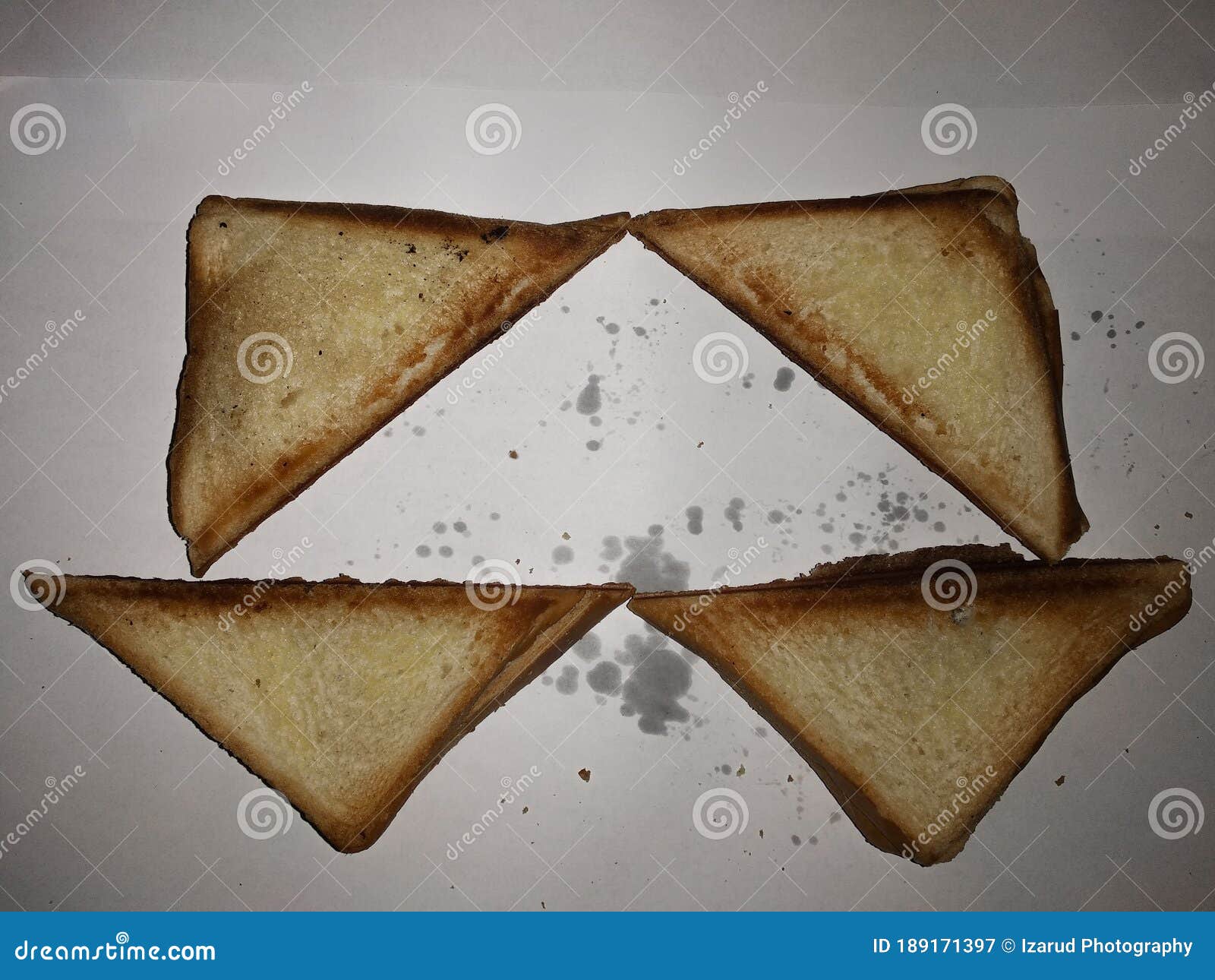 Four Warm Half-burnt Toast on a White Background. Stock Image - Image ...