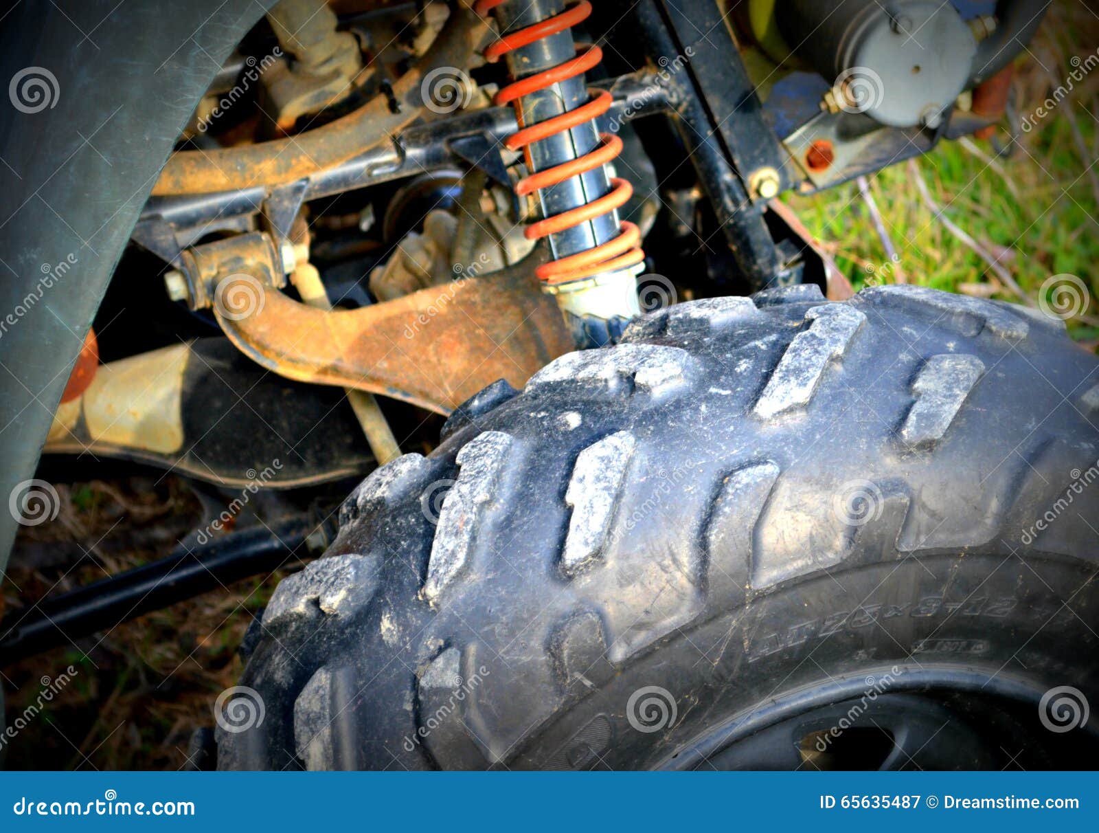 Four wheeler tire stock image. Image of orange, grass - 65635487