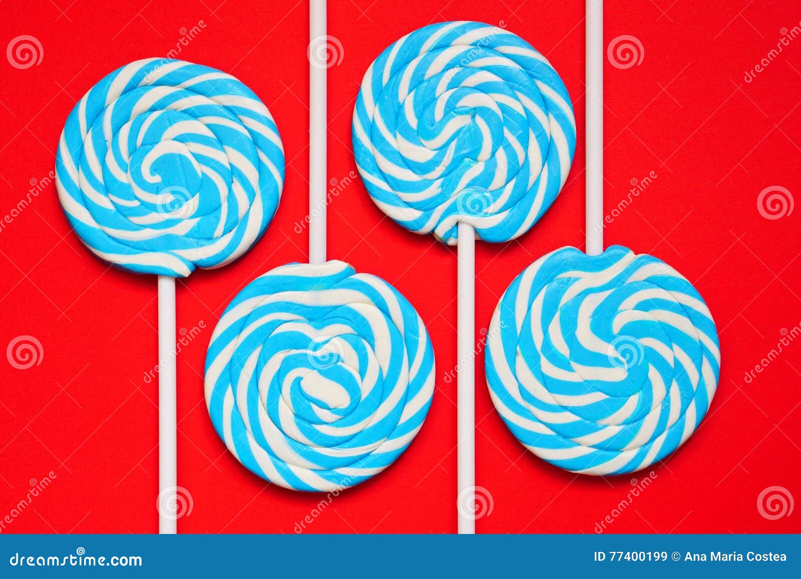 Four White and Blue Lollipops on Red Background Stock Image - Image of ...