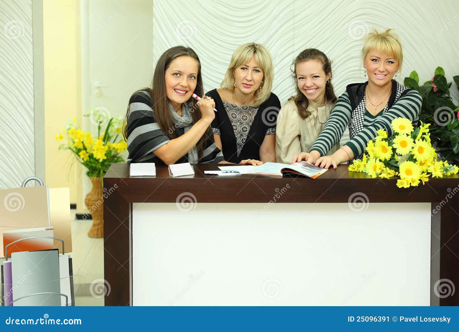 Four Women Sit in Reception Area with Magazines Stock Image - Image of ...