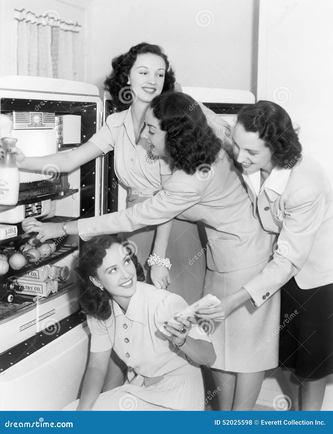 Four Women Taking Things from a Refrigerator Stock Photo - Image of ...