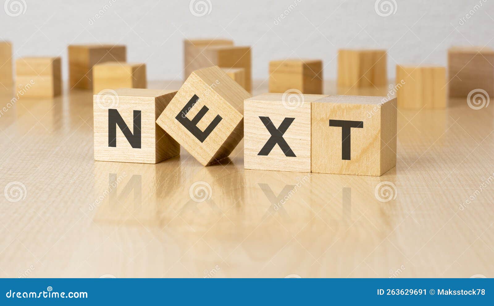 Four Wooden Blocks with Text NEXT on Table. Copy Space. White ...