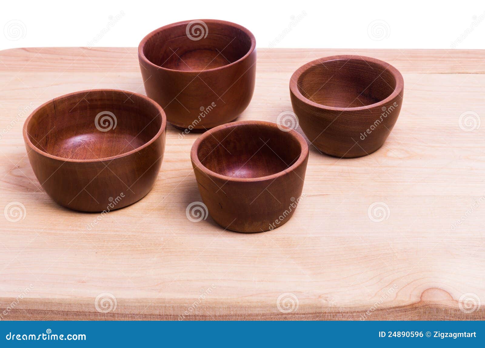 Four Wooden Bowls on Cutting Board Stock Photo - Image of hand, turning ...
