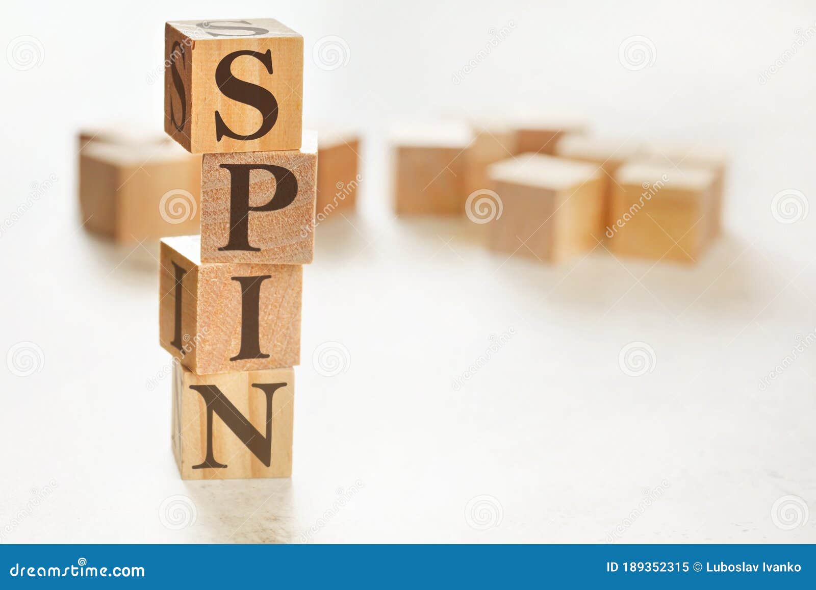 Four Wooden Cubes Arranged in Stack with Word SPIN Meaning Solution ...