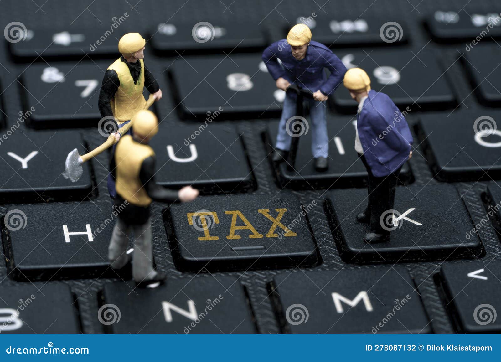 Four Worker Miniature Figure Standing and Digging on Computer Keyboard ...