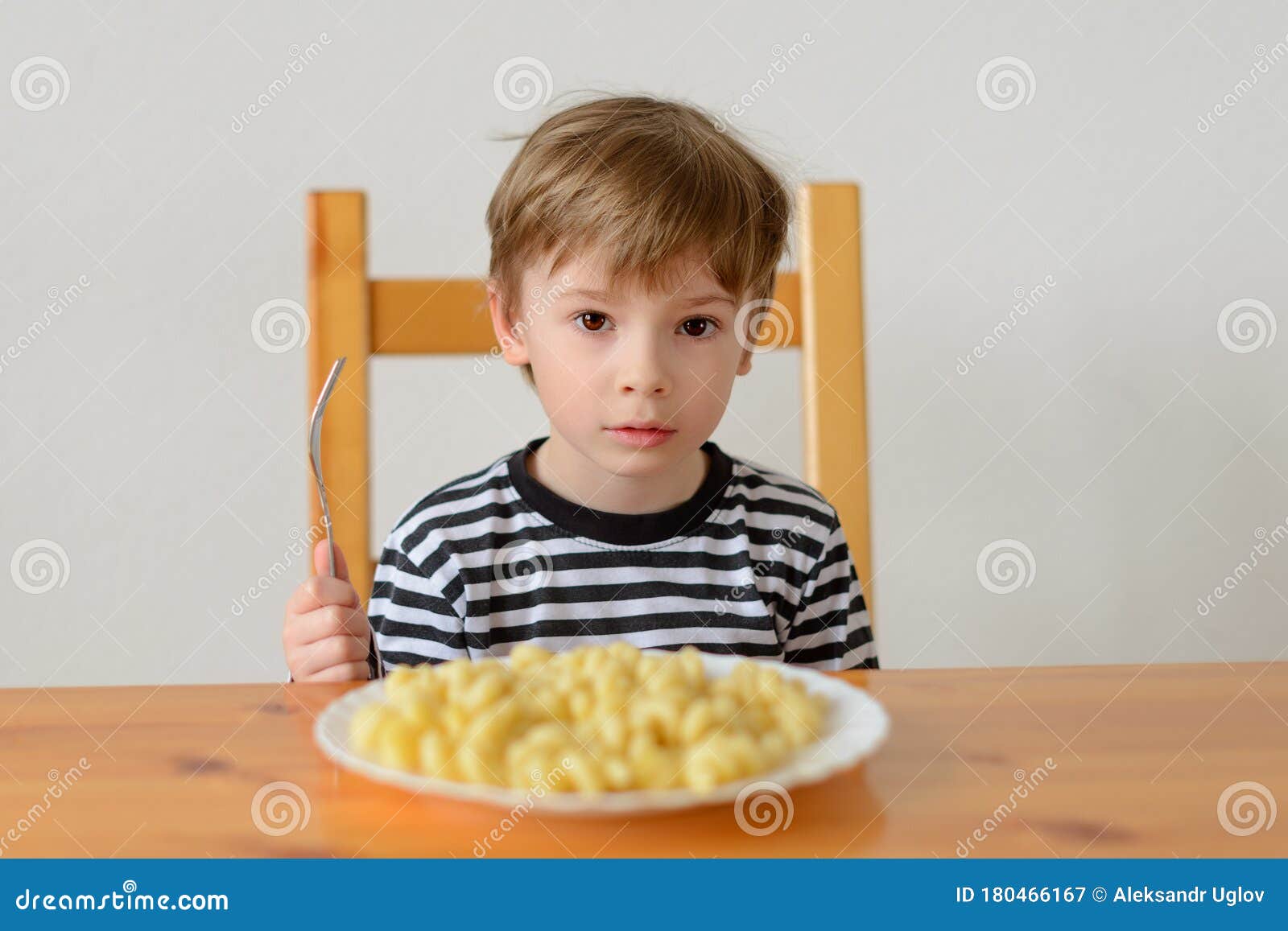 Four Year Old Boy Eating Macaroni Stock Image - Image of kitchen ...