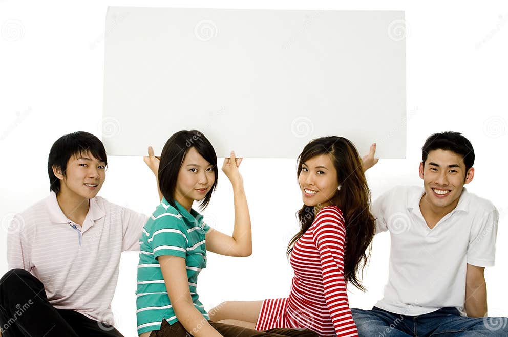 Four Young Adults with Sign Stock Photo - Image of sign, clothing: 1806788
