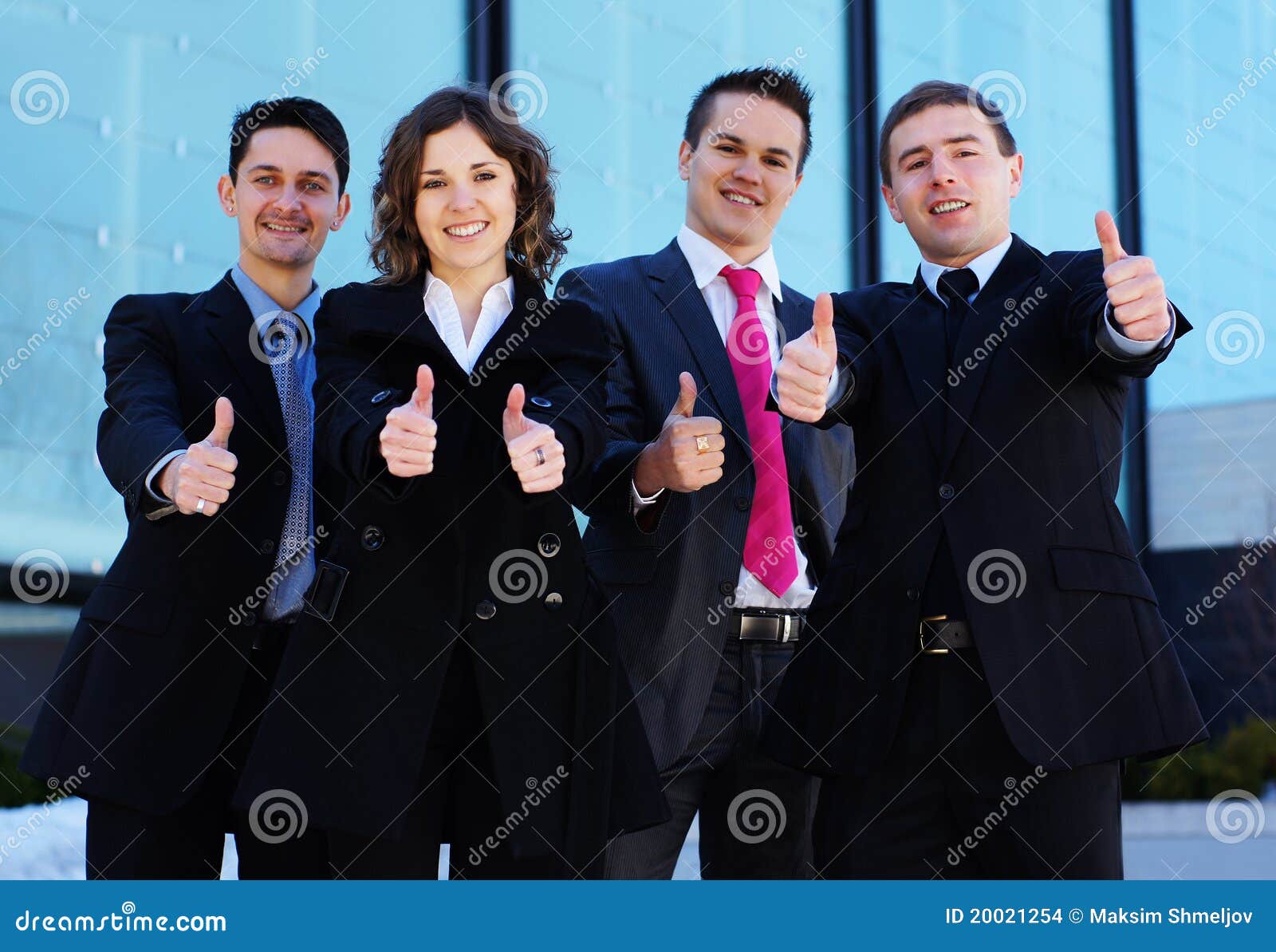 Four Young Business Persons Holding Thumbs Up Stock Photo - Image of ...