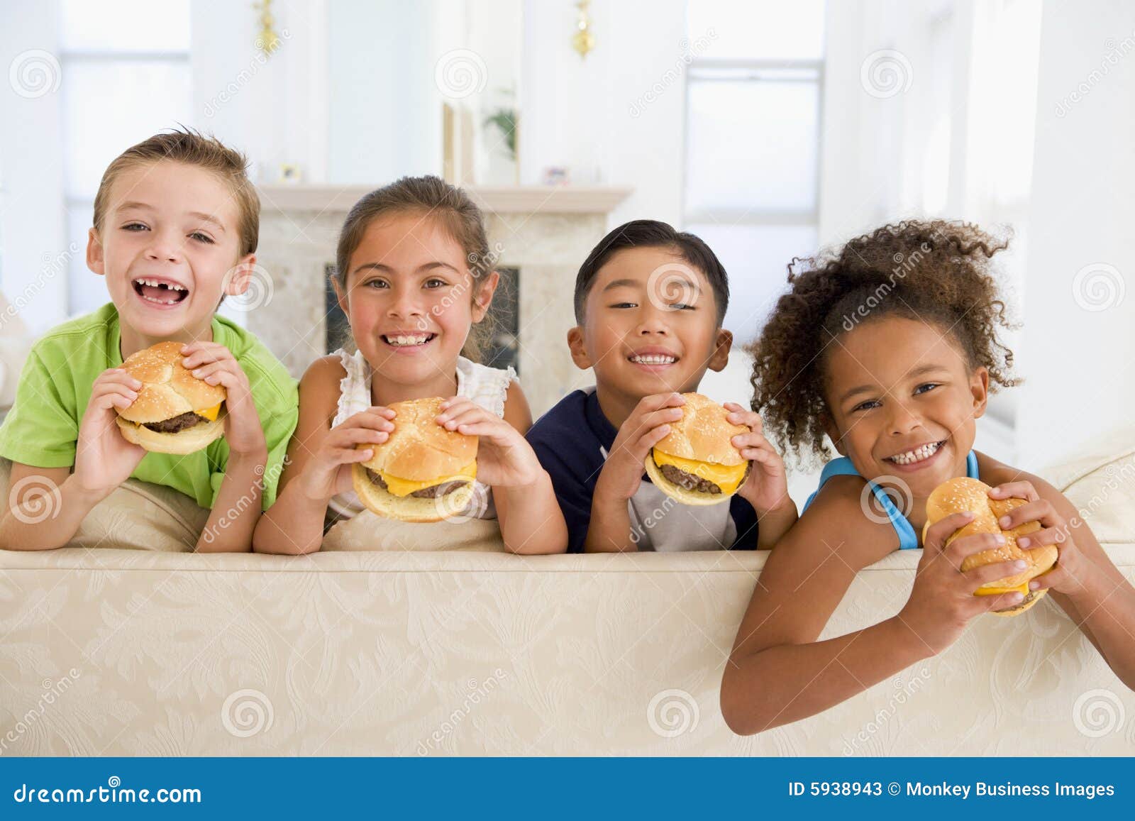 Four Young Children Eating Cheeseburgers Stock Image - Image of kids ...