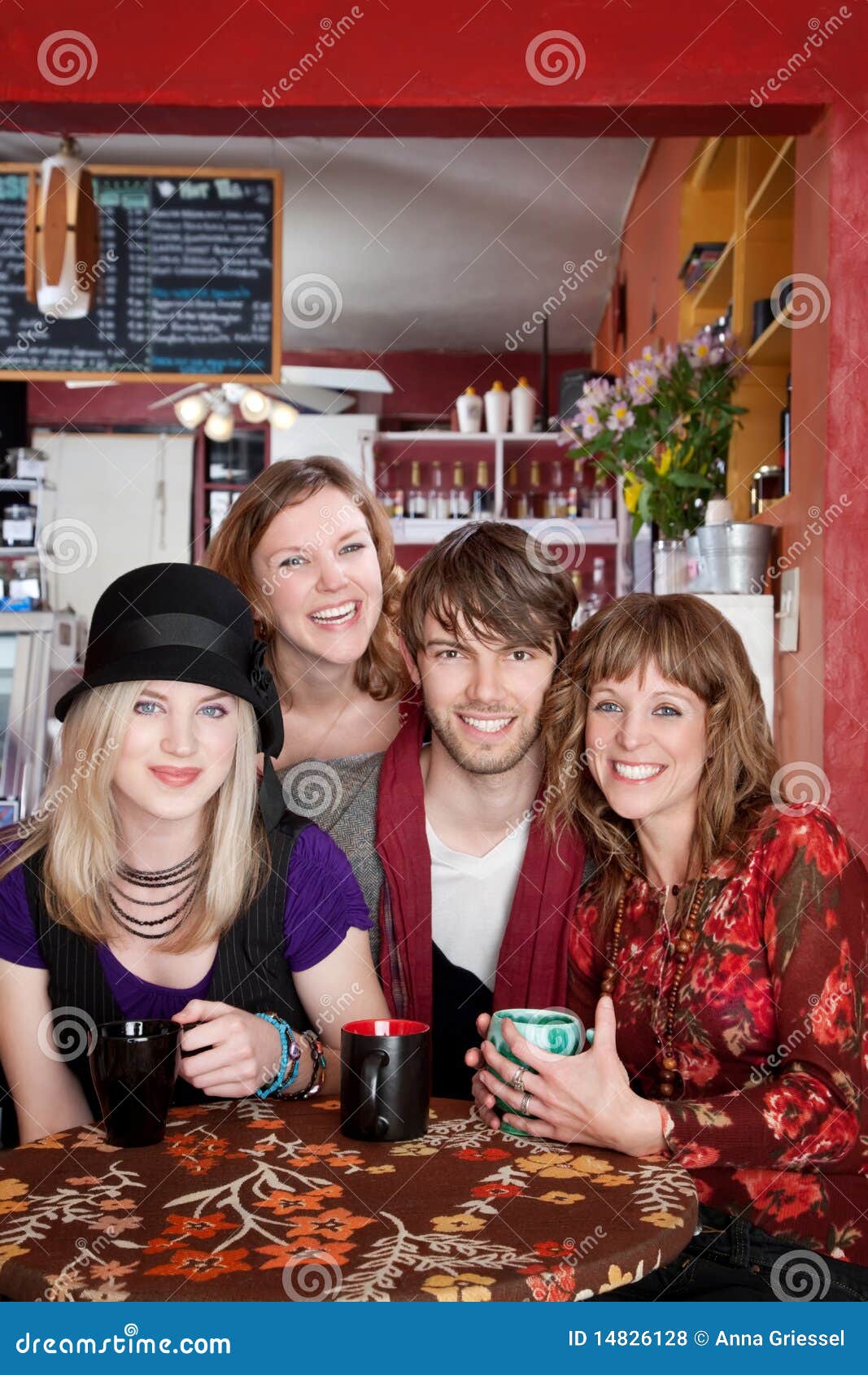 Four Young Happy Friends at a Cafe Stock Photo - Image of menu, latino ...