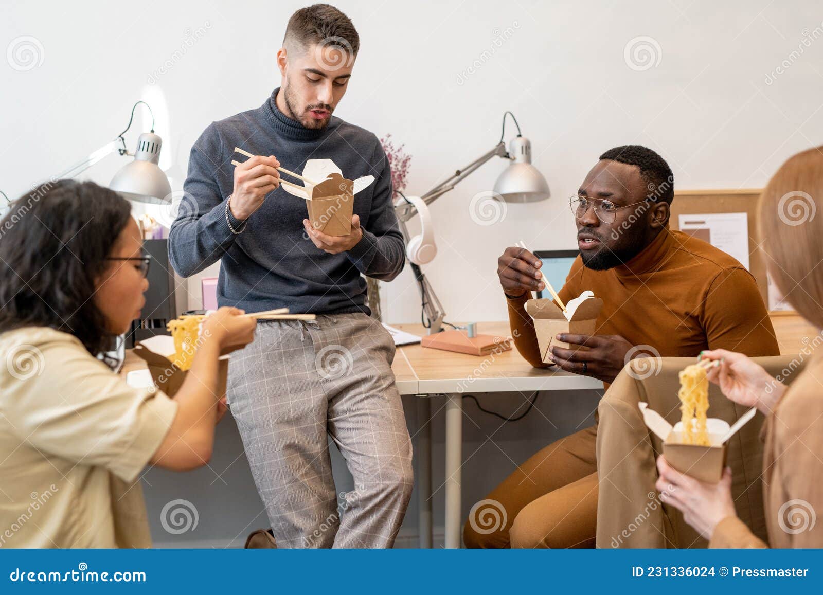 Four Young Intercultural Office Workers Having Chinese Wok for Lunch ...