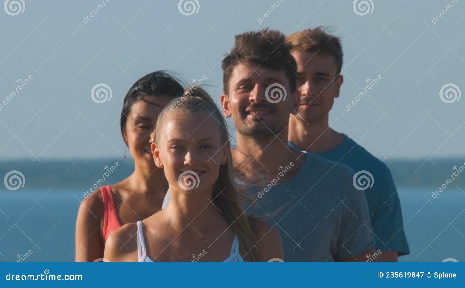 The Four Young People Standing One by One. Stock Image - Image of ...