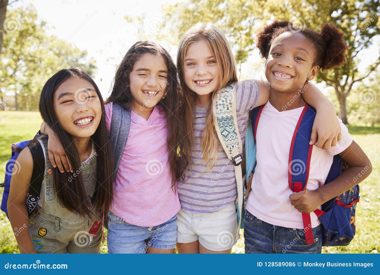 Four Young Smiling Schoolgirls on a School Trip Stock Photo - Image of ...