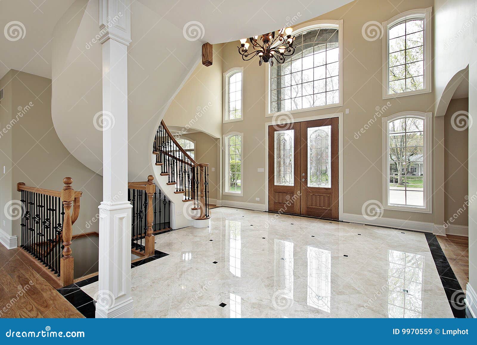 Foyer and Circular Staircase Stock Image - Image of furnishings, chair ...