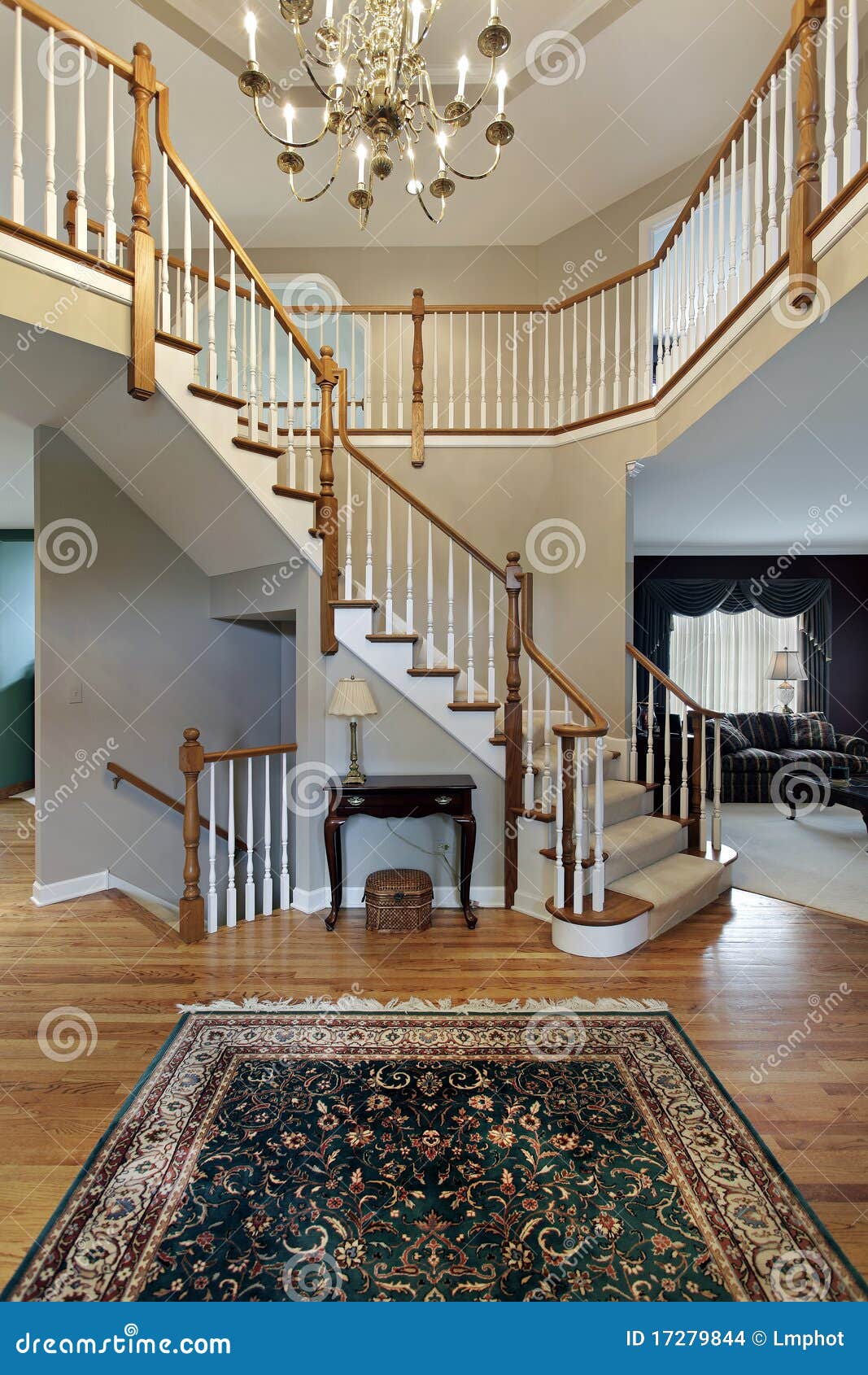 Foyer with Wood Trim Railing Stock Photo - Image of foyer, carpet: 17279844