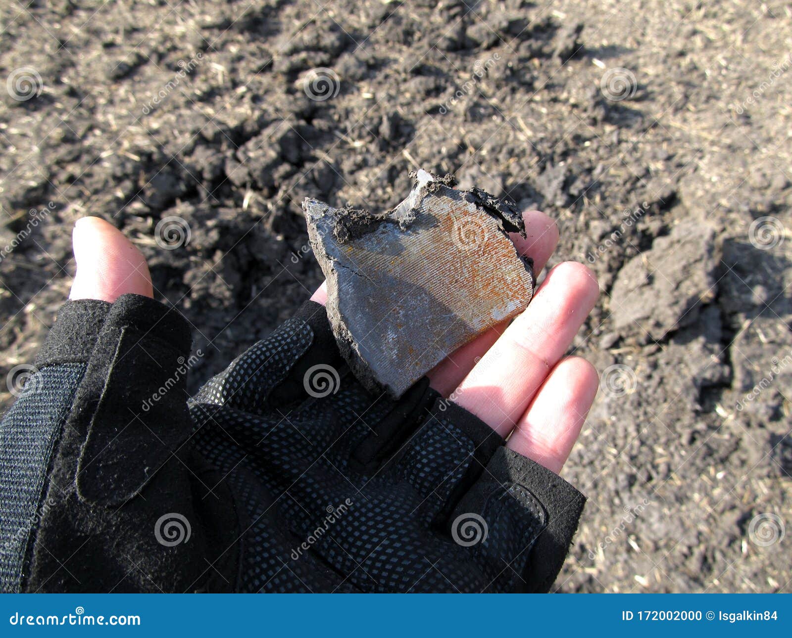A Fragment of an Artillery Shell in the Combatantâ€™s Hand Stock Photo ...