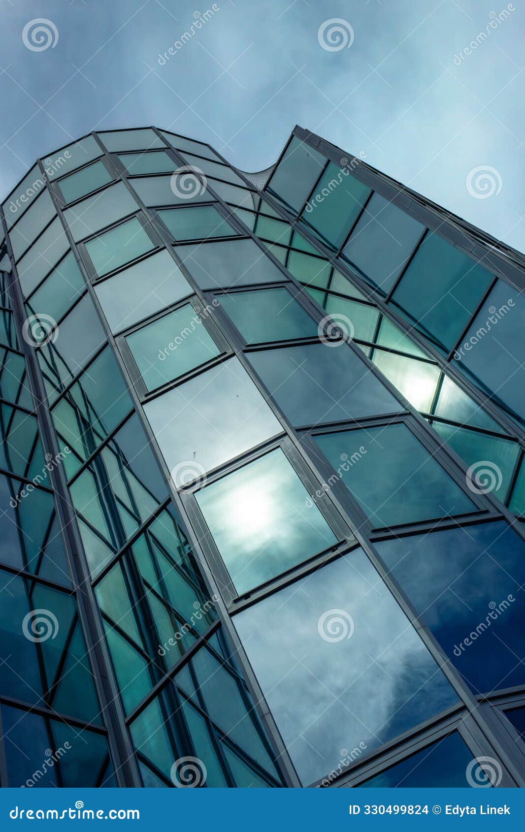 Blue Glass Wall Of Skyscraper. Looking Up Of Sky Reflections On Part Of ...