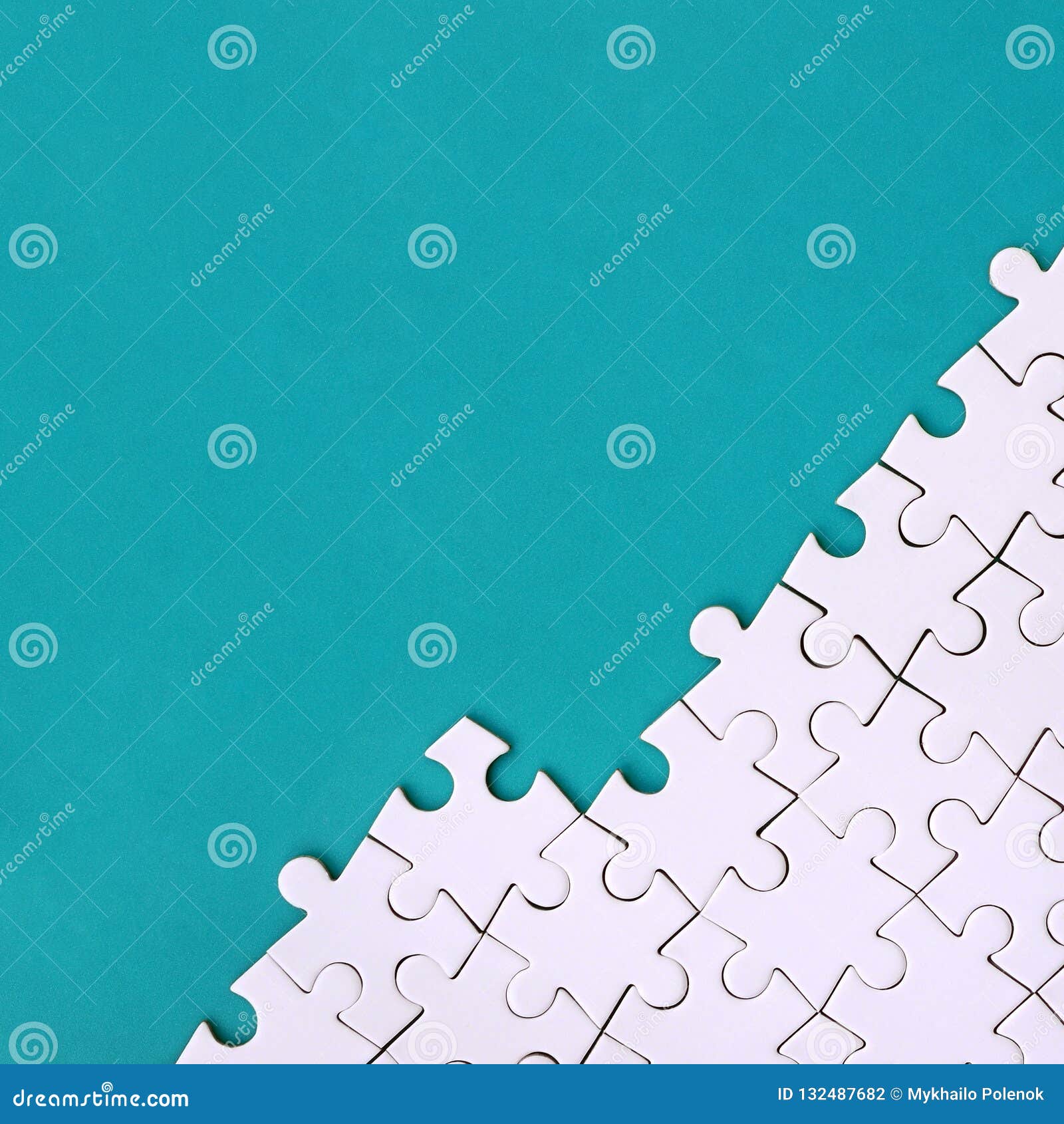Fragment of a Folded White Jigsaw Puzzle on the Background of a Blue ...