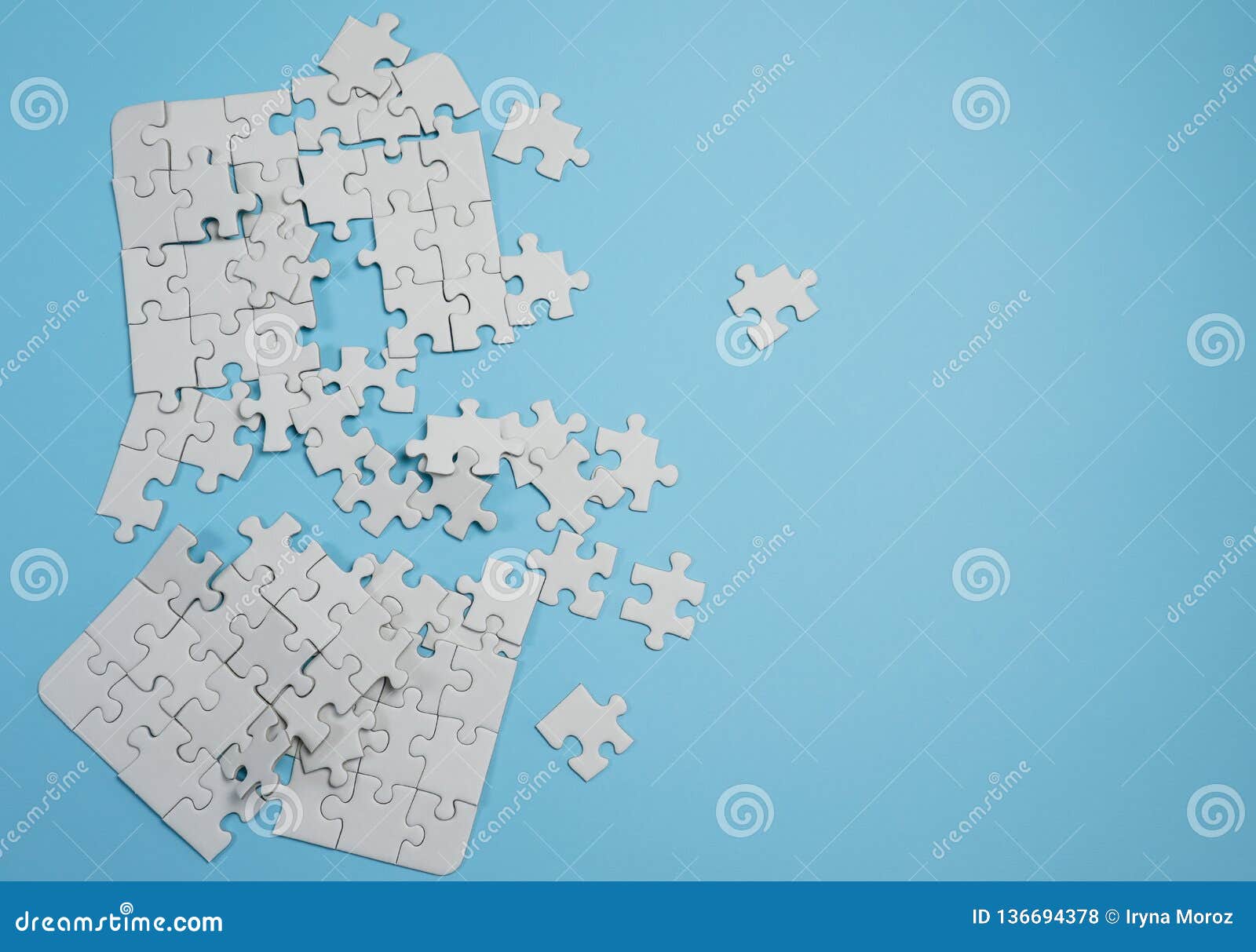 Fragment of a Folded White Jigsaw Puzzle and a Pile of Uncombed Puzzle ...