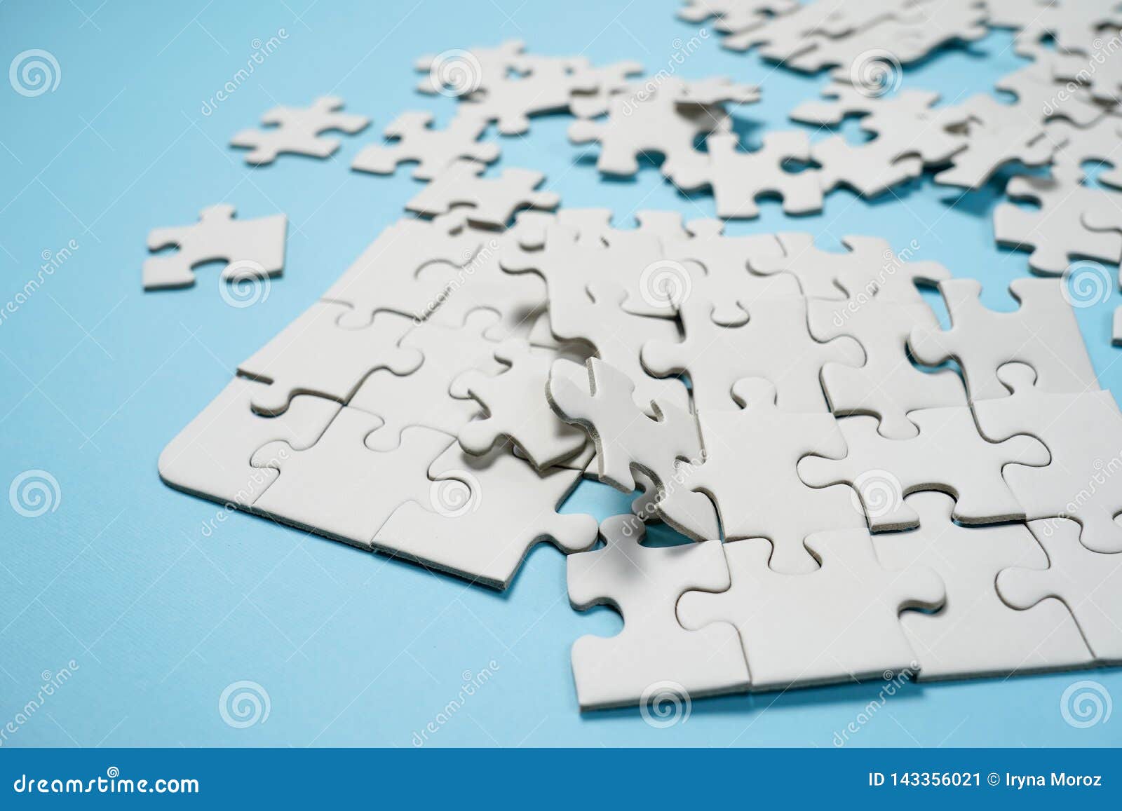 Fragment of a Folded White Jigsaw Puzzle and a Pile of Uncombed Puzzle ...