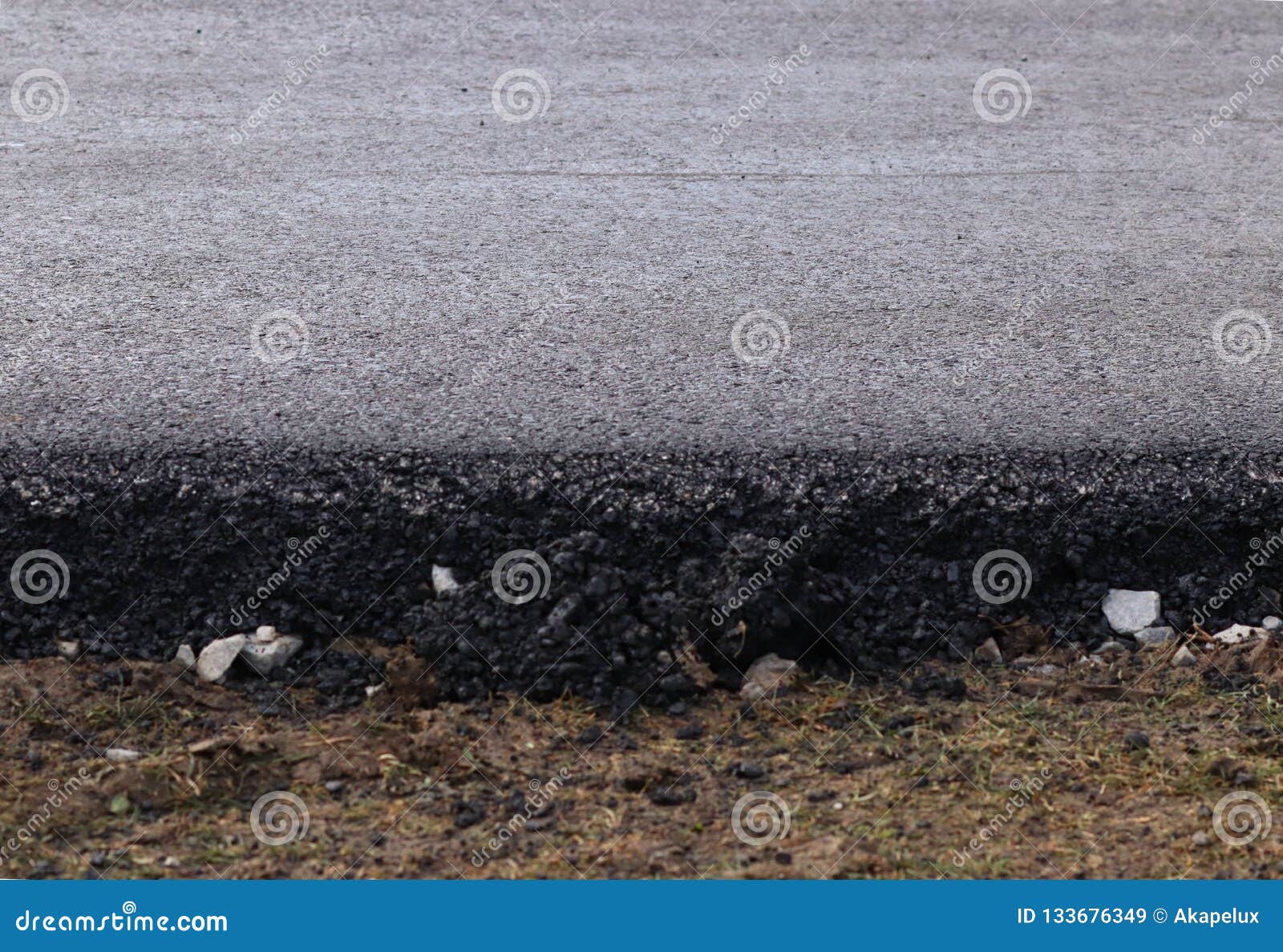 Fragment of Freshly Laid Black Asphalt on a Cushion of Rubble. Modern ...