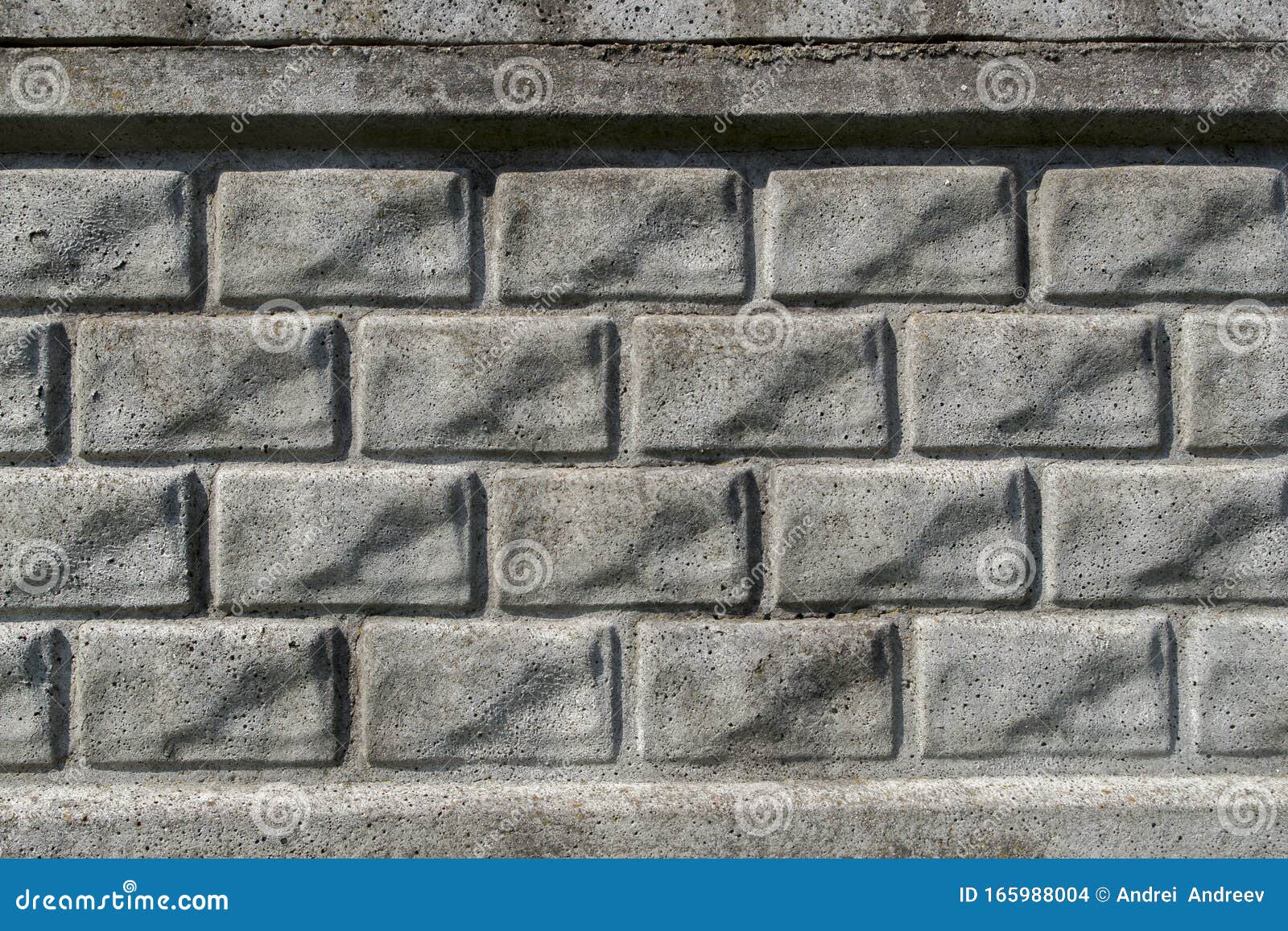 A Fragment of Gray Concrete Relief Wall or Fence Imitating Several Rows ...