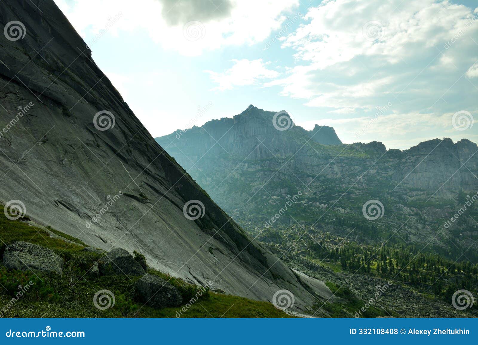 A Fragment of a High Cliff in the Rays of the Setting Bright Summer Sun ...