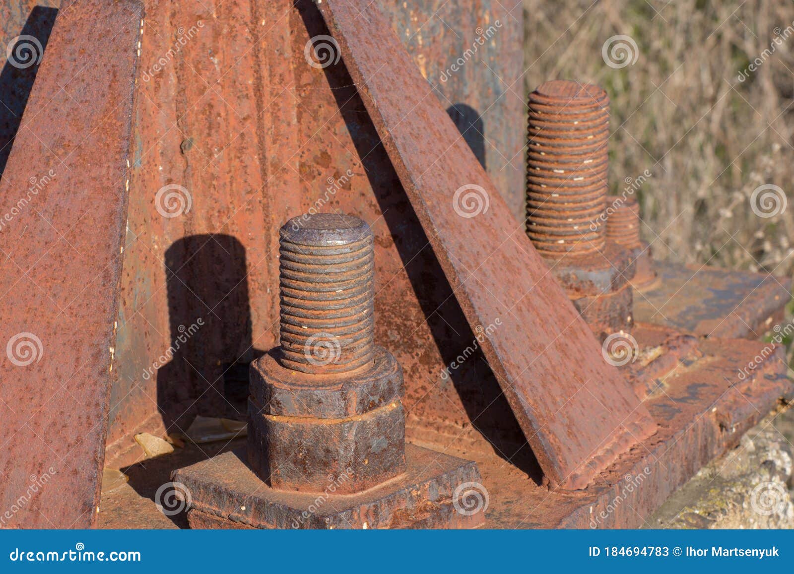 Fragment of a Rusty Metal Construction with Bolts and Nuts. a High ...