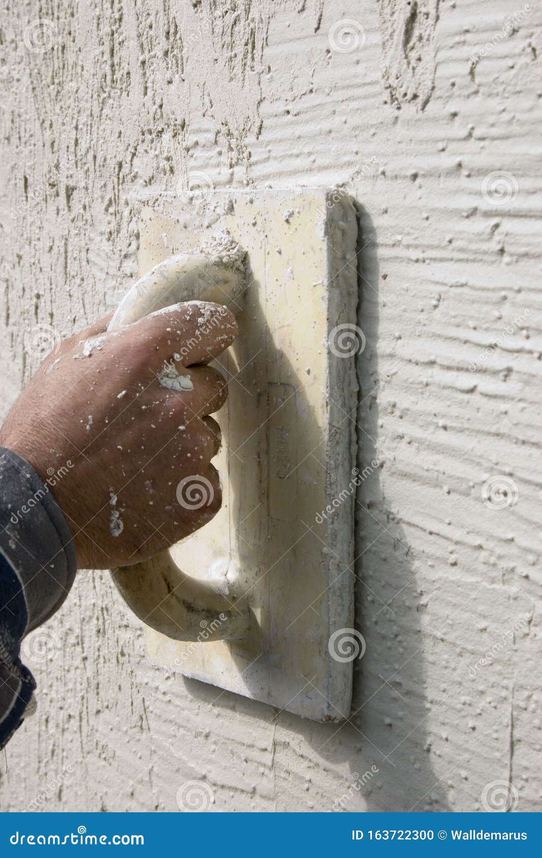 Hand Of Plasterer Holds Old Trowel, Scrubbing Concrete Wall, Removes ...