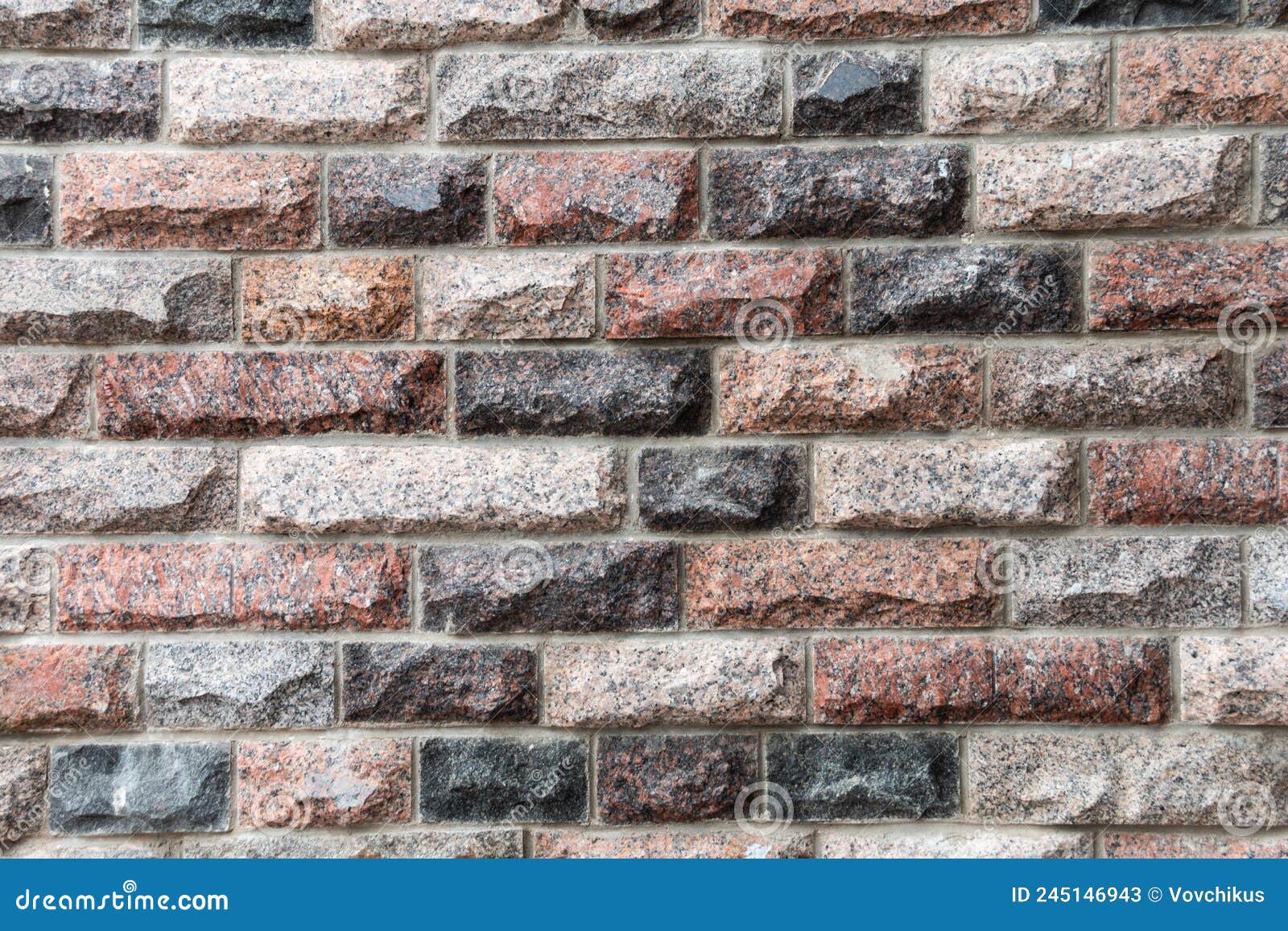 Fragment of a Wall Made of Granite Bricks with Layers of Cement. Stock ...