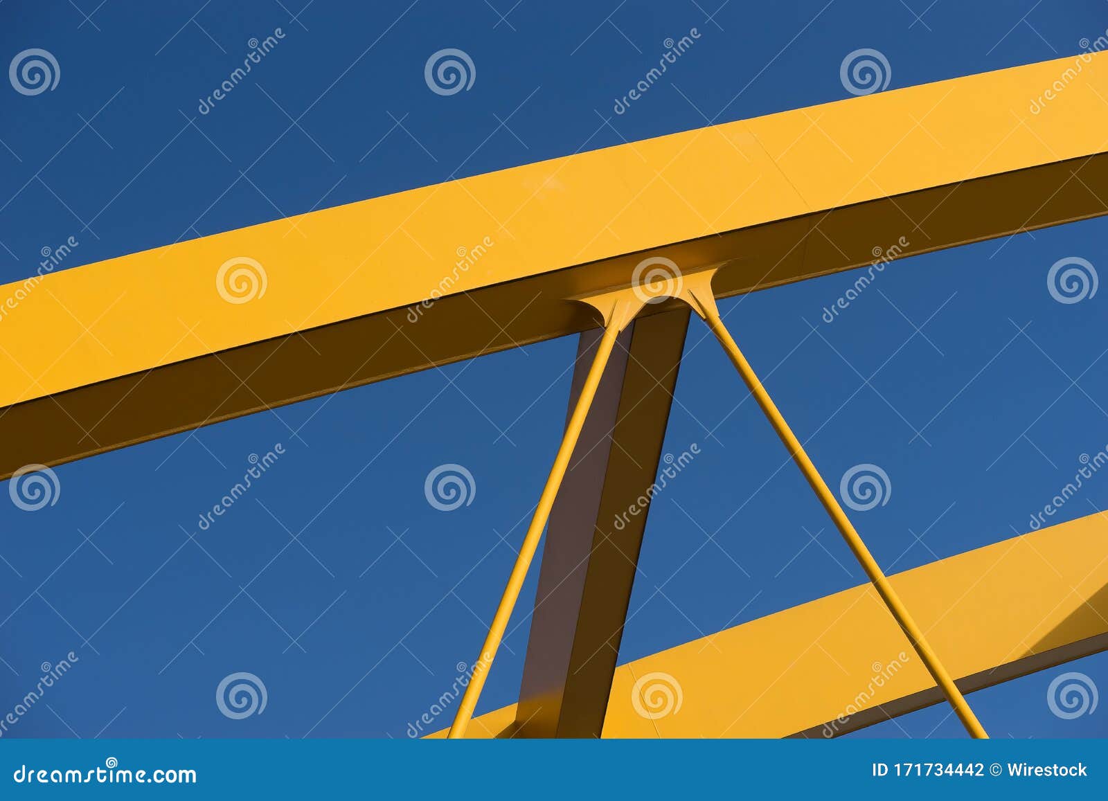 Fragments of a Modern Yellow Construction with a Blue Background Stock ...