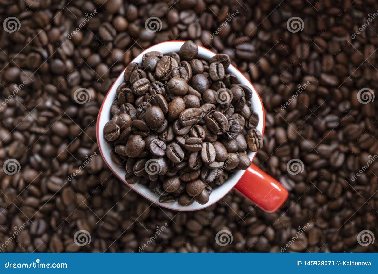 Fragrant Coffee Beans in a Red Cup and on a Blurred Background. Top ...