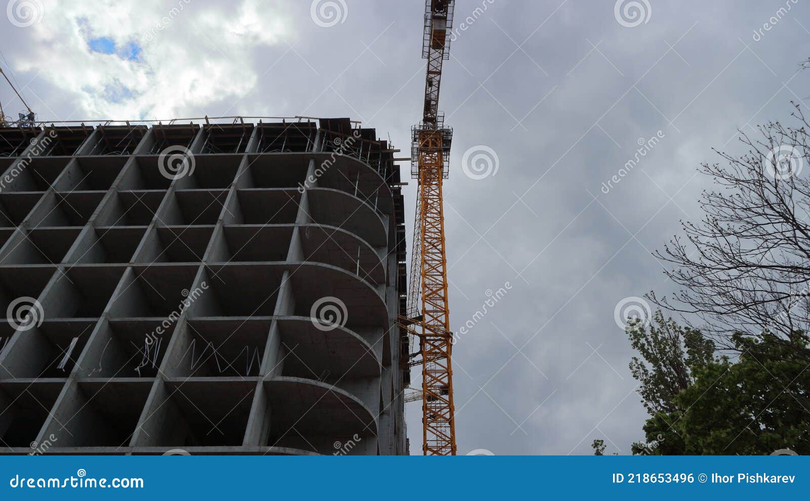 The Frame of a Building Under Construction and a Crane Stock Photo ...