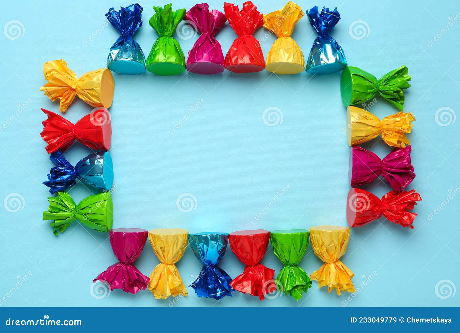 Frame of Candies in Colorful Wrappers on Light Blue Background, Flat ...
