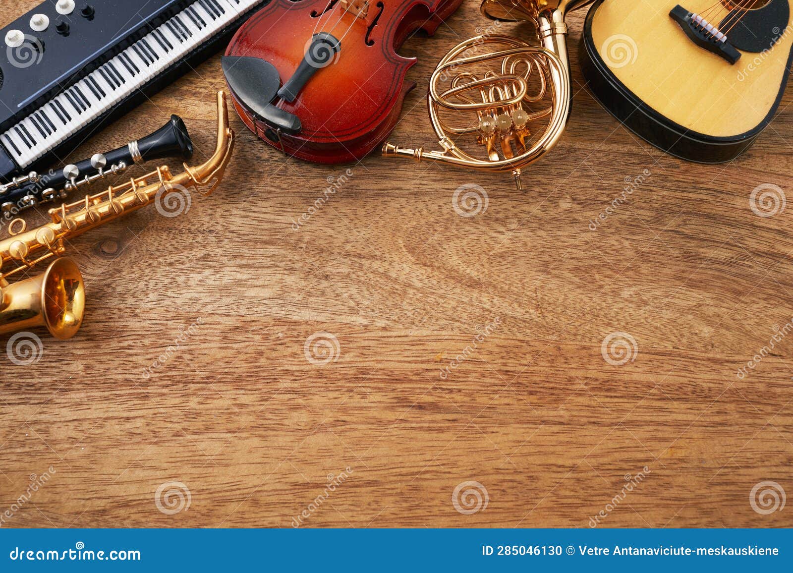 Frame of Different Musical Instruments on Wooden Background Stock Photo ...