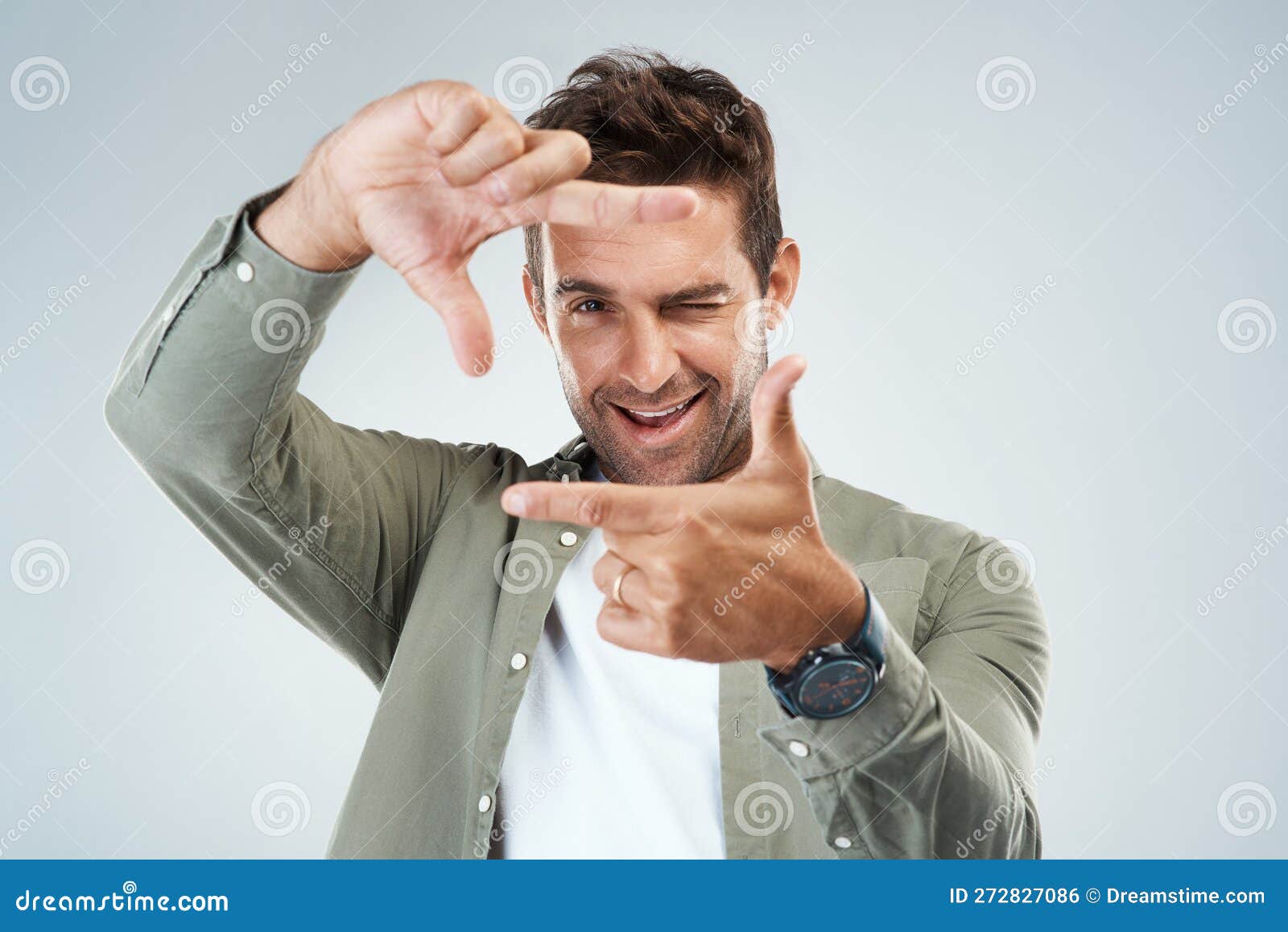 Frame by Frame. Portrait of a Cheerful Young Man Making Frames with His ...