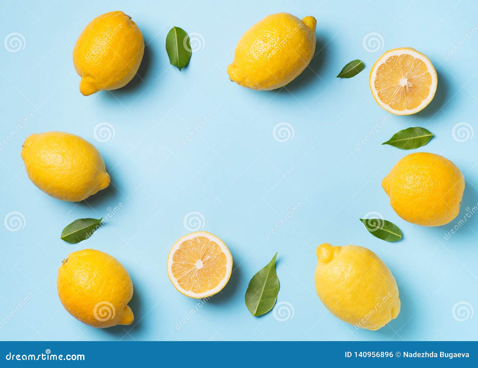 Frame of Half and Full Lemons on Blue Background Stock Photo - Image of ...