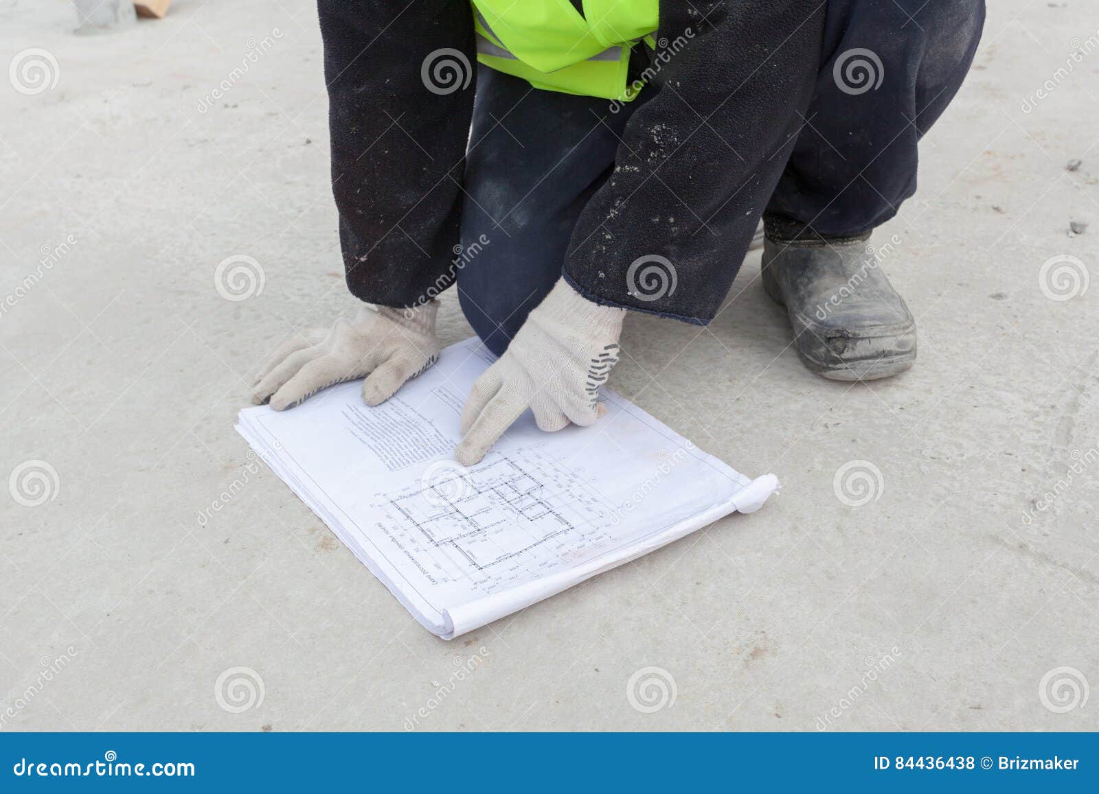 Frame House Construction. Worker Looks on Scheme of Arrangement of Wall ...