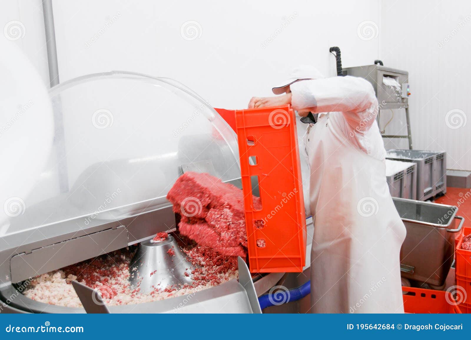 Cropped Image of a Worker at the Meat Processing Factory, Adds Spices ...