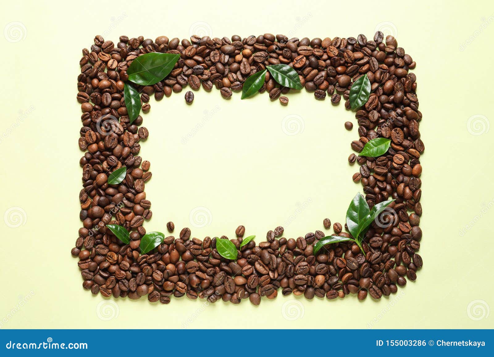 Frame Made of Fresh Green Coffee Leaves and Beans on Light Green ...